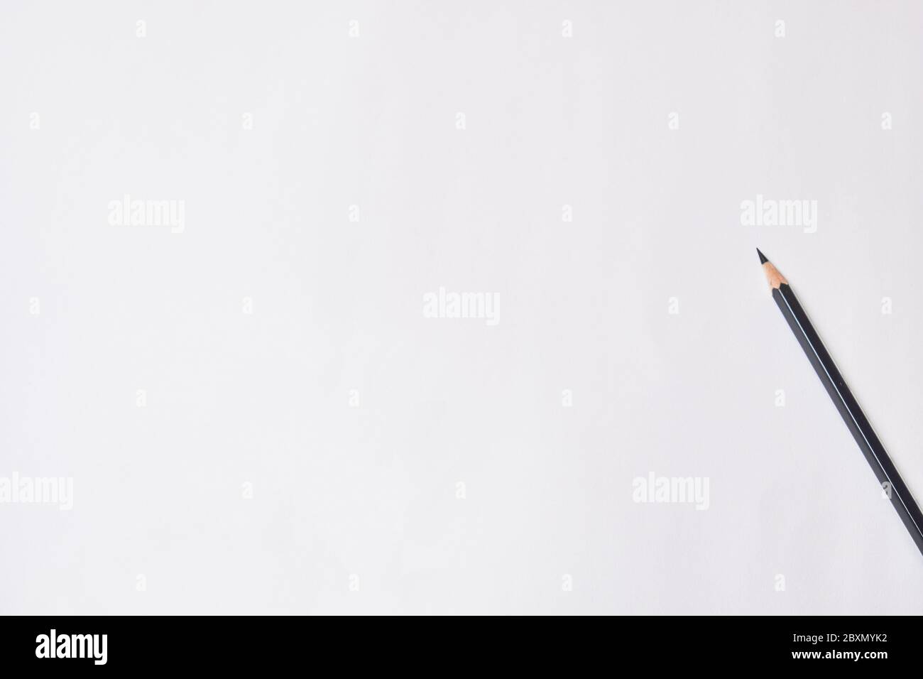 Pencil at white background with copy space Stock Photo - Alamy