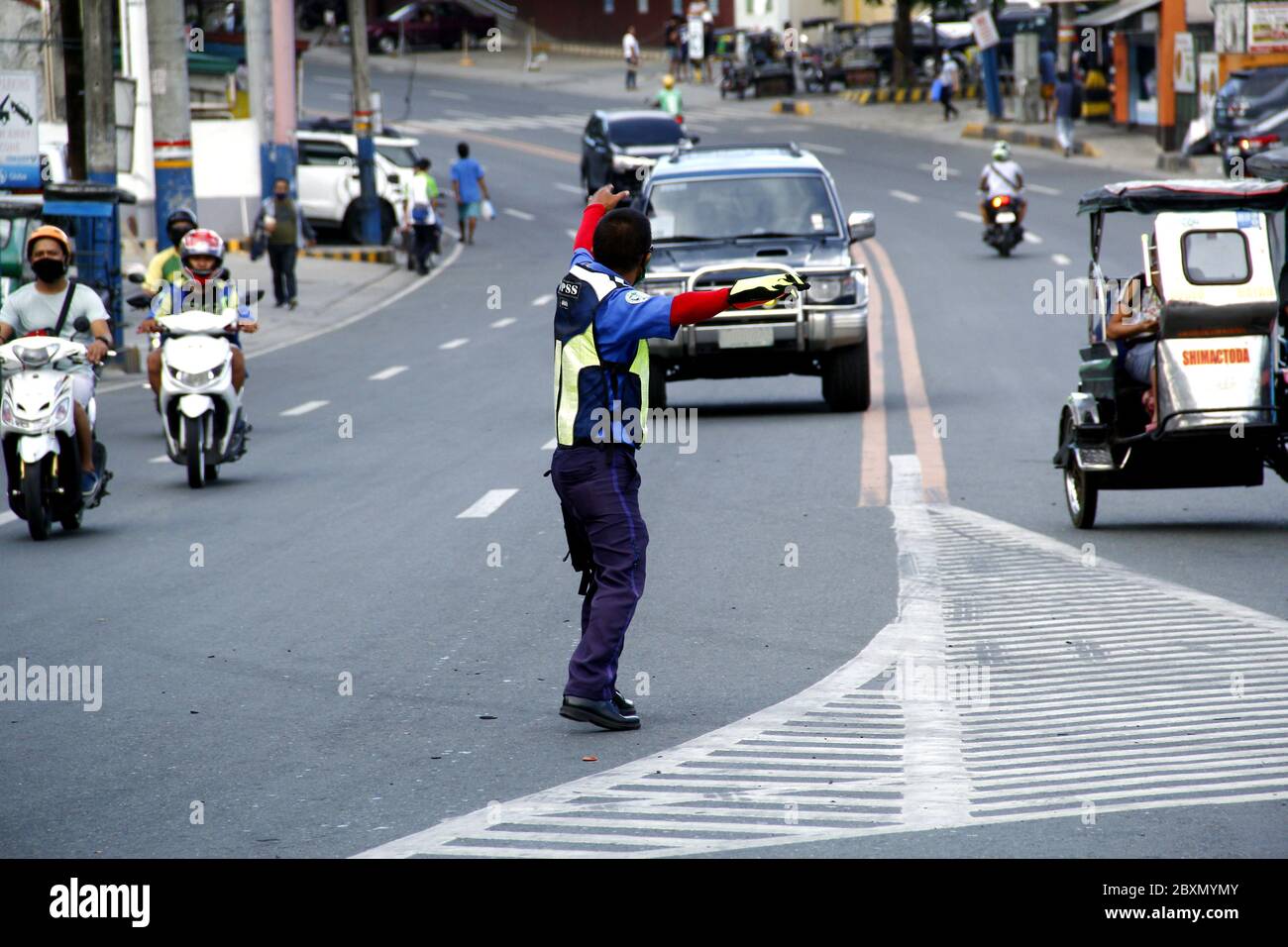 Antipolo City, Philippines - June 1, 2020: Traffic officers direct and ...