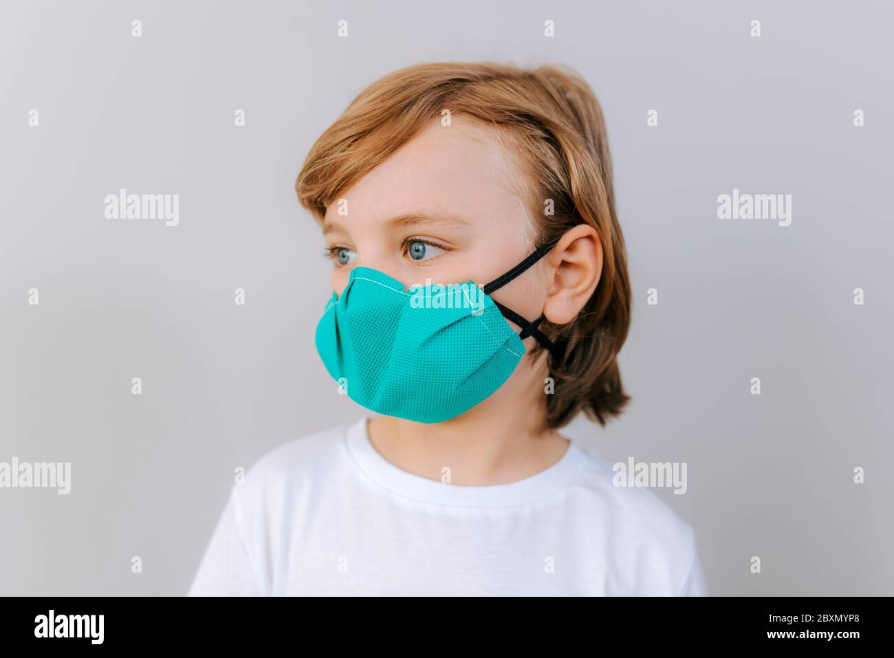 Portrait of little boy with medical face mask looking at camera. child ...