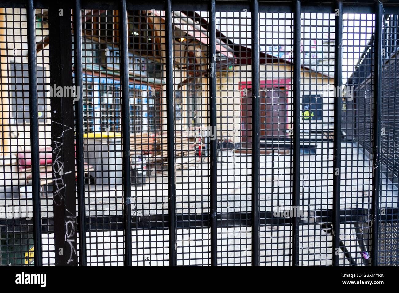 Closed terrace black fence grid Stock Photo - Alamy