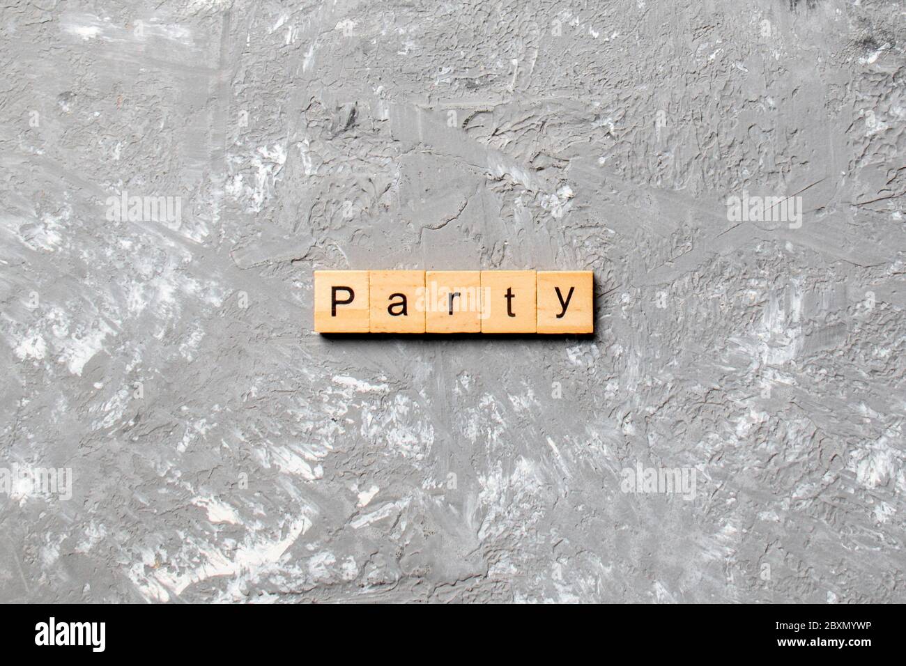 PARTY word written on wood block. PARTY text on cement table for your desing, concept Stock ...