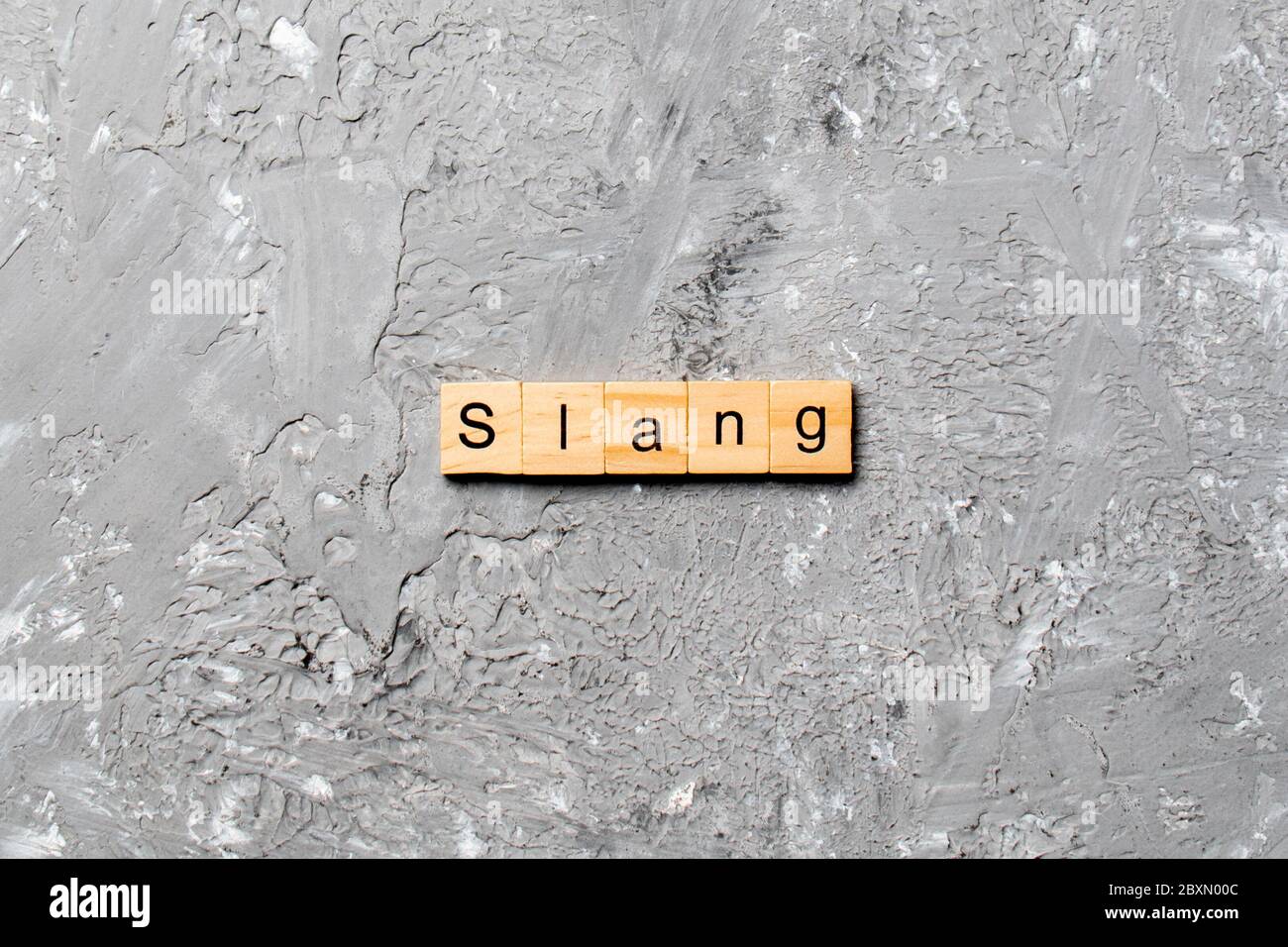 slang word written on wood block. slang text on table, concept Stock ...