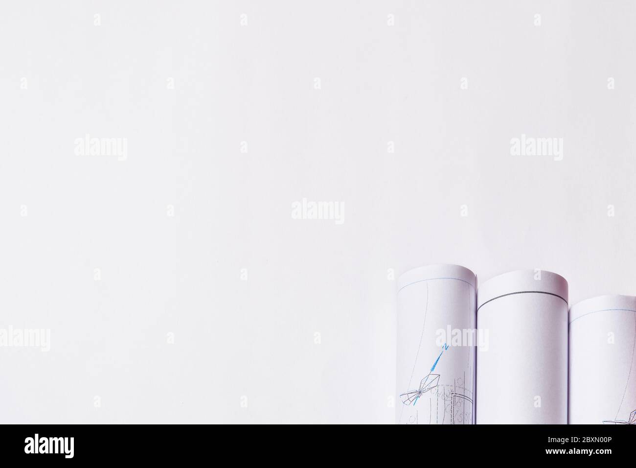 Rolled engineering drawings at white background with copy space Stock ...