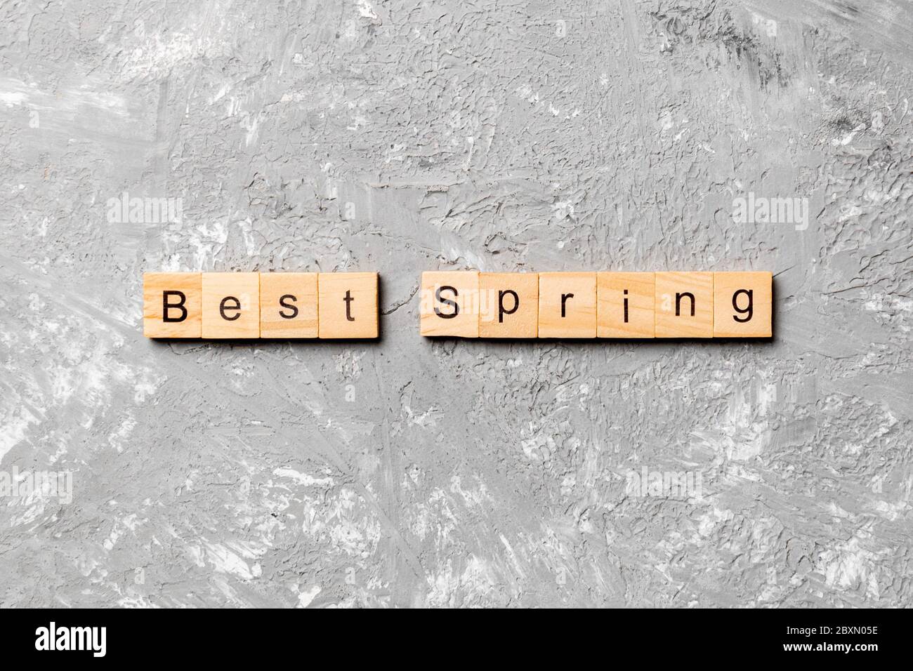 best Spring word written on wood block. best Spring text on cement ...