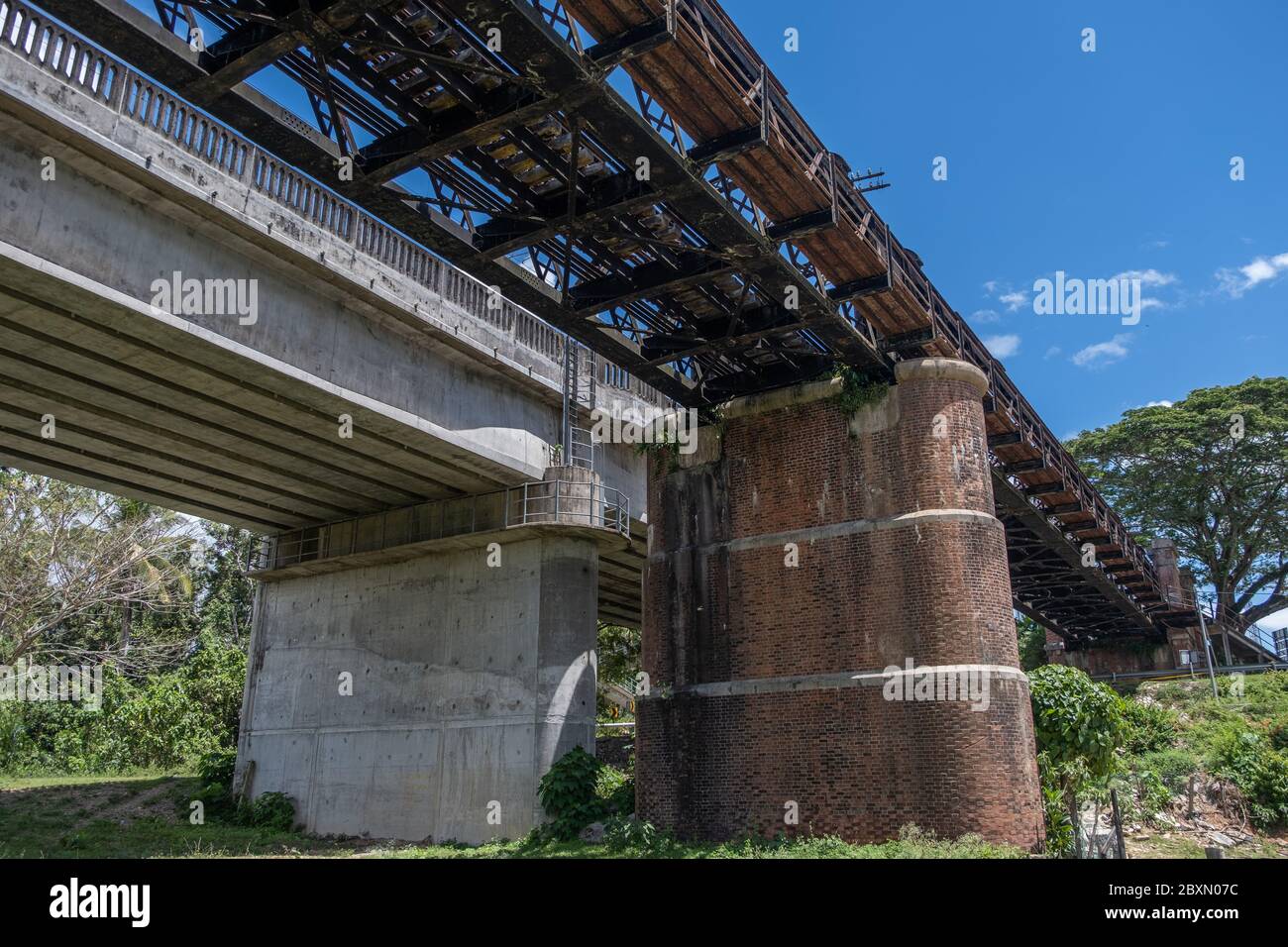 Victoria Bridge, and old iron railway bridge crossing the Perak River ...