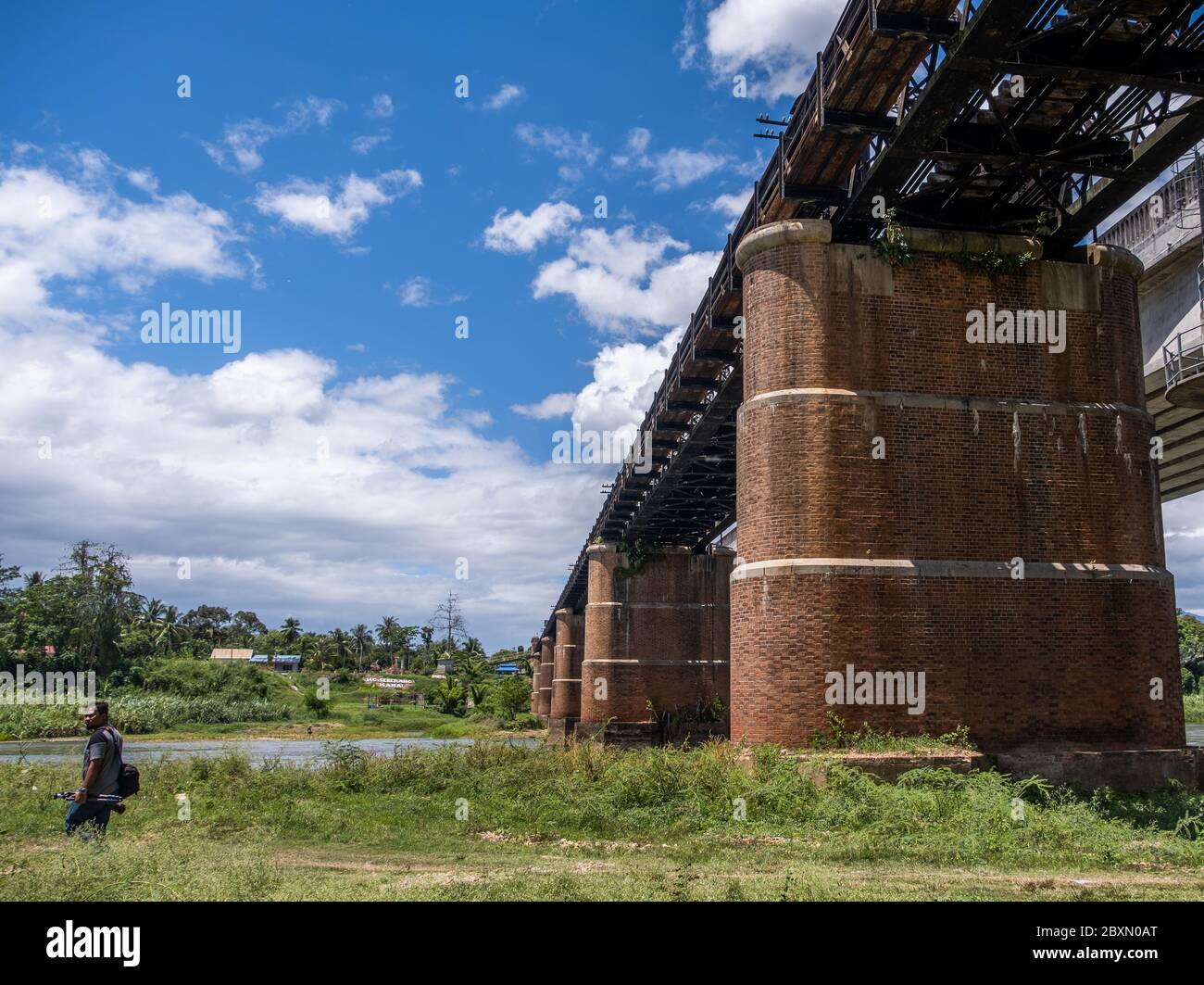 Victoria Bridge, and old iron railway bridge crossing the Perak River ...