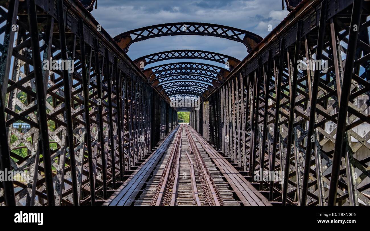 Victoria Bridge, and old iron railway bridge crossing the Perak River ...
