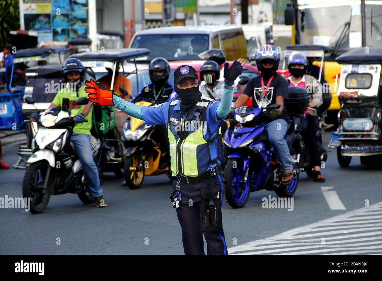 Antipolo City, Philippines - June 1, 2020: Traffic officers direct and ...