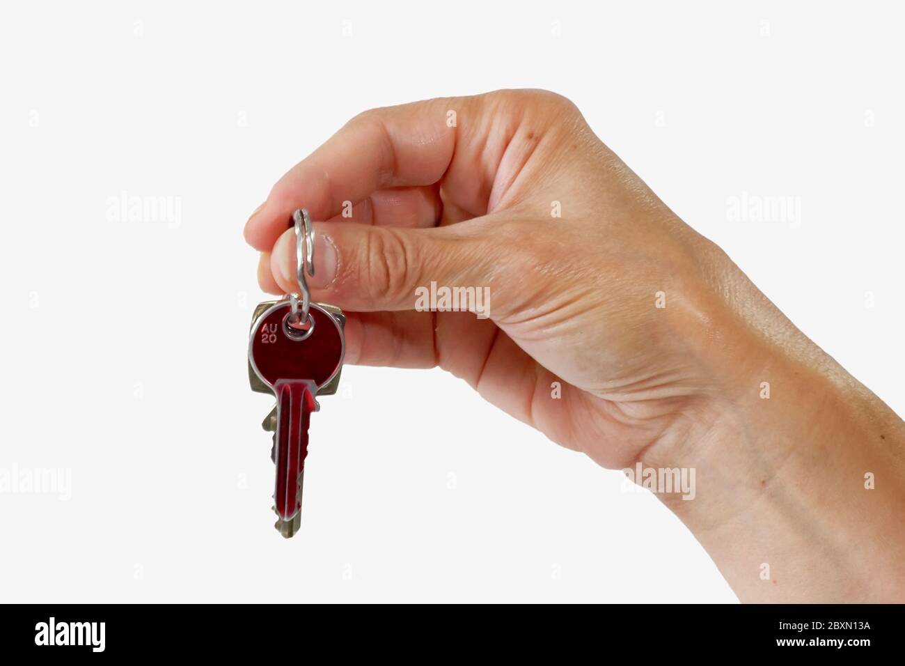 Key in his hand Stock Photo - Alamy