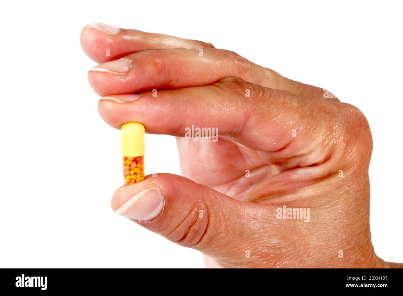 Capsule in his hand Stock Photo - Alamy