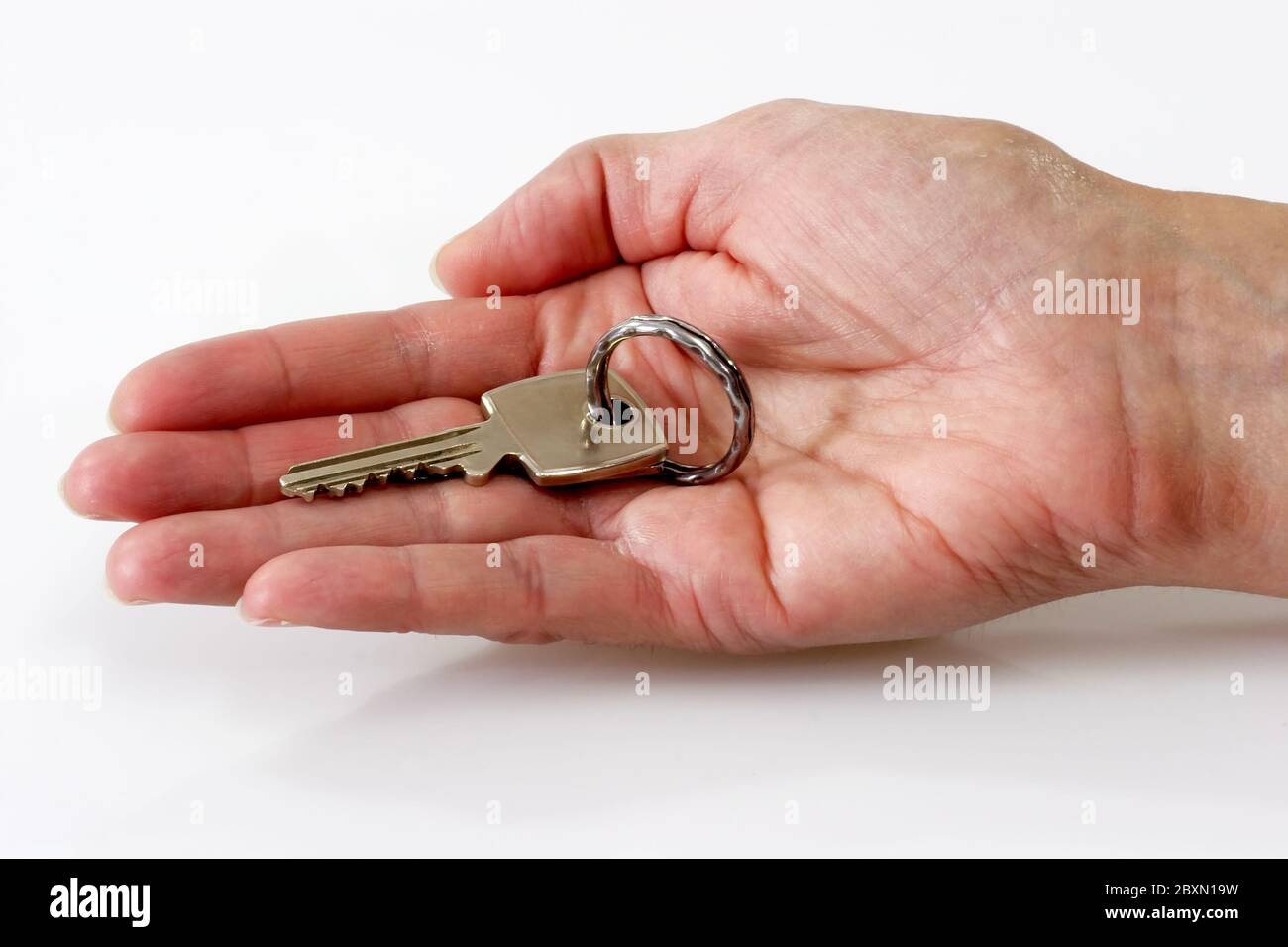 Key in his hand Stock Photo - Alamy
