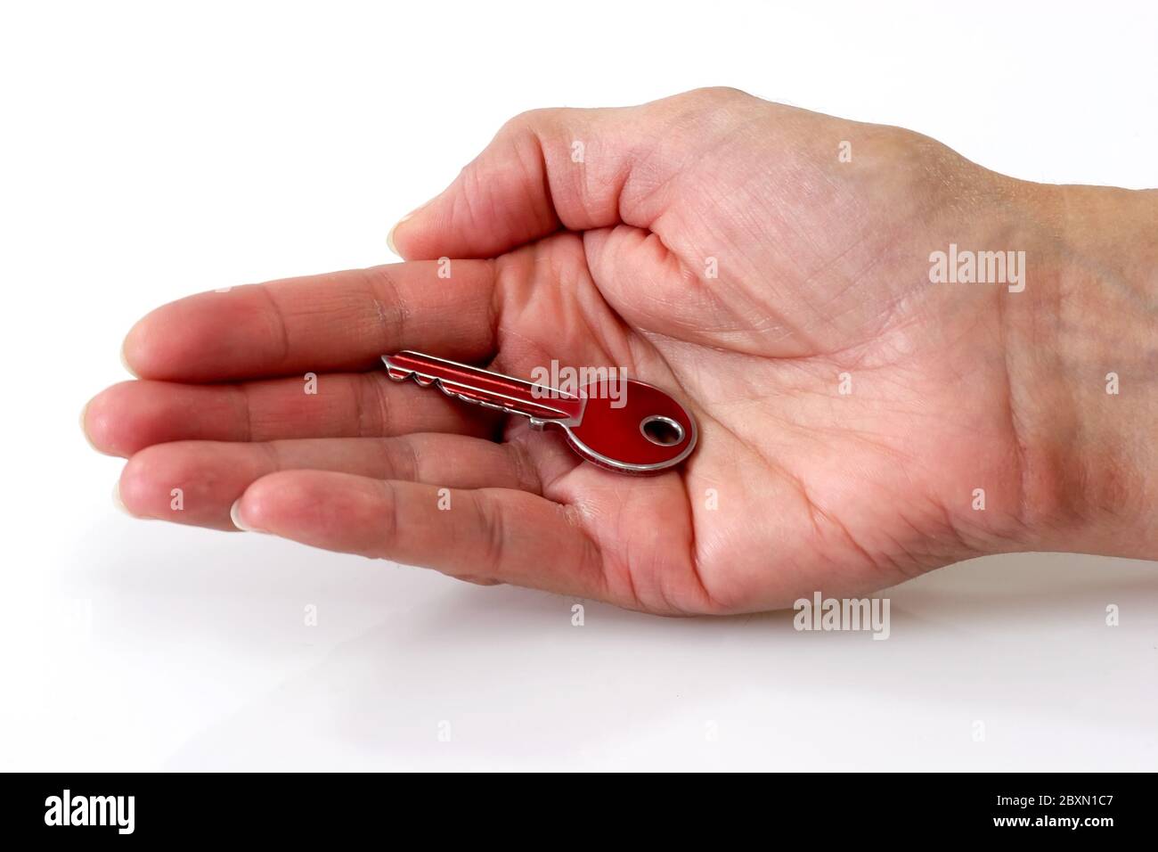 Key in his hand Stock Photo - Alamy