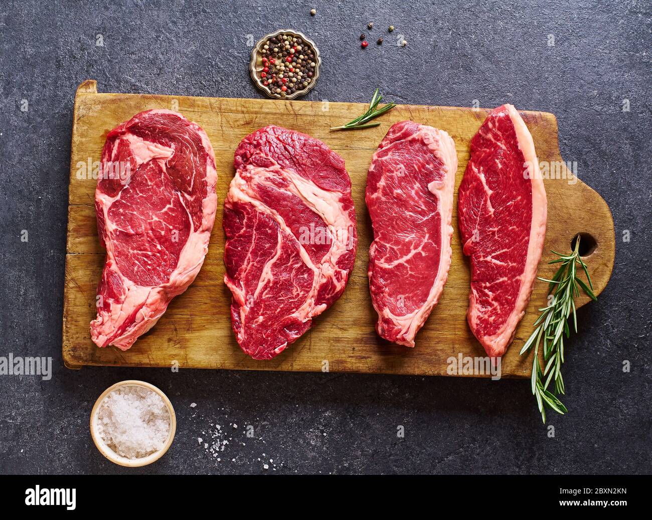 Variety of fresh Black Angus Prime raw beef steakes: ribeye, striploin ...