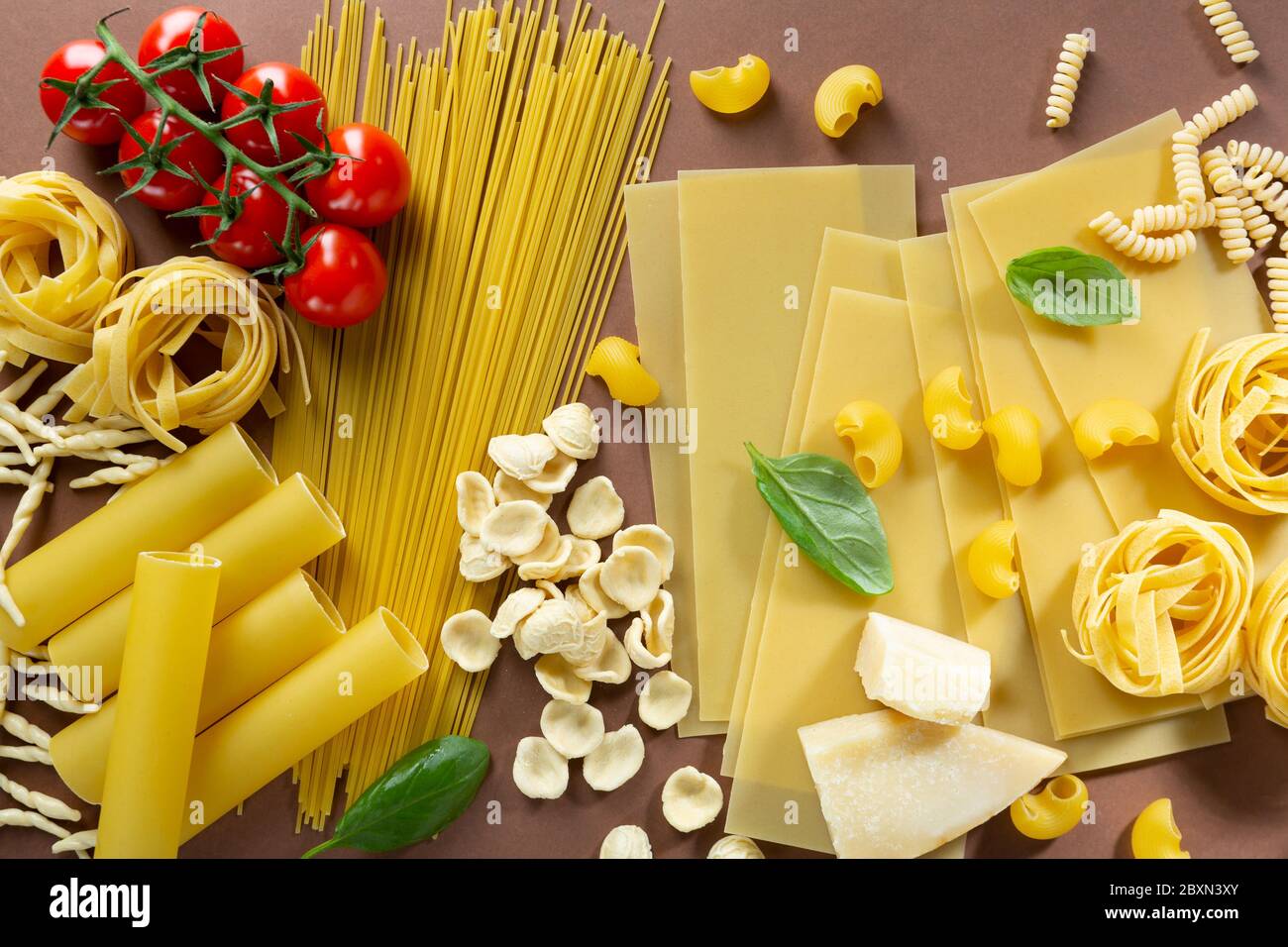 Different pasta and ingredients food background Stock Photo - Alamy