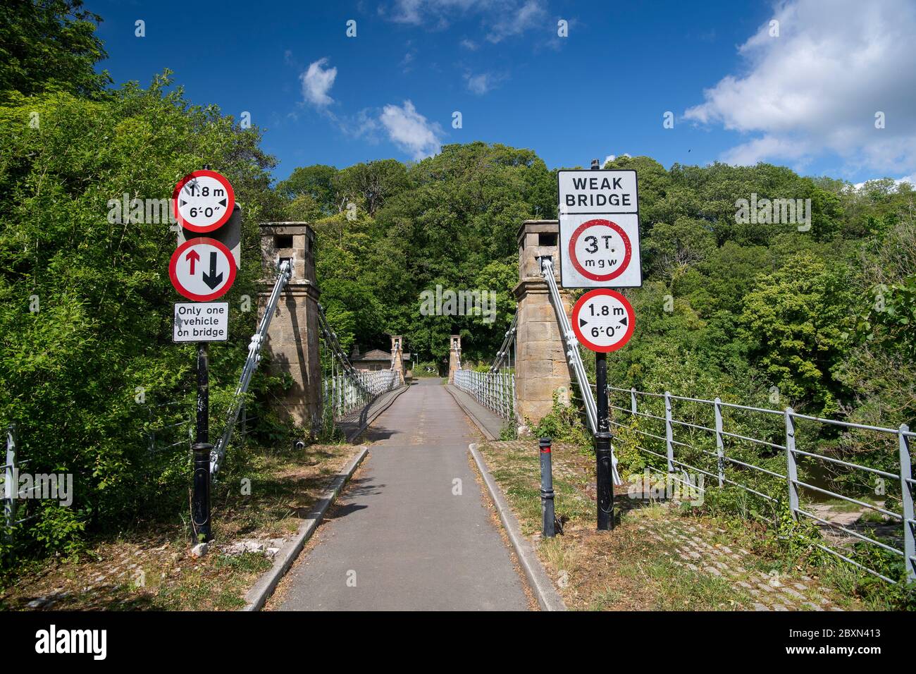 Whorlton suspension bridge, a narrow single track bridge over the River ...