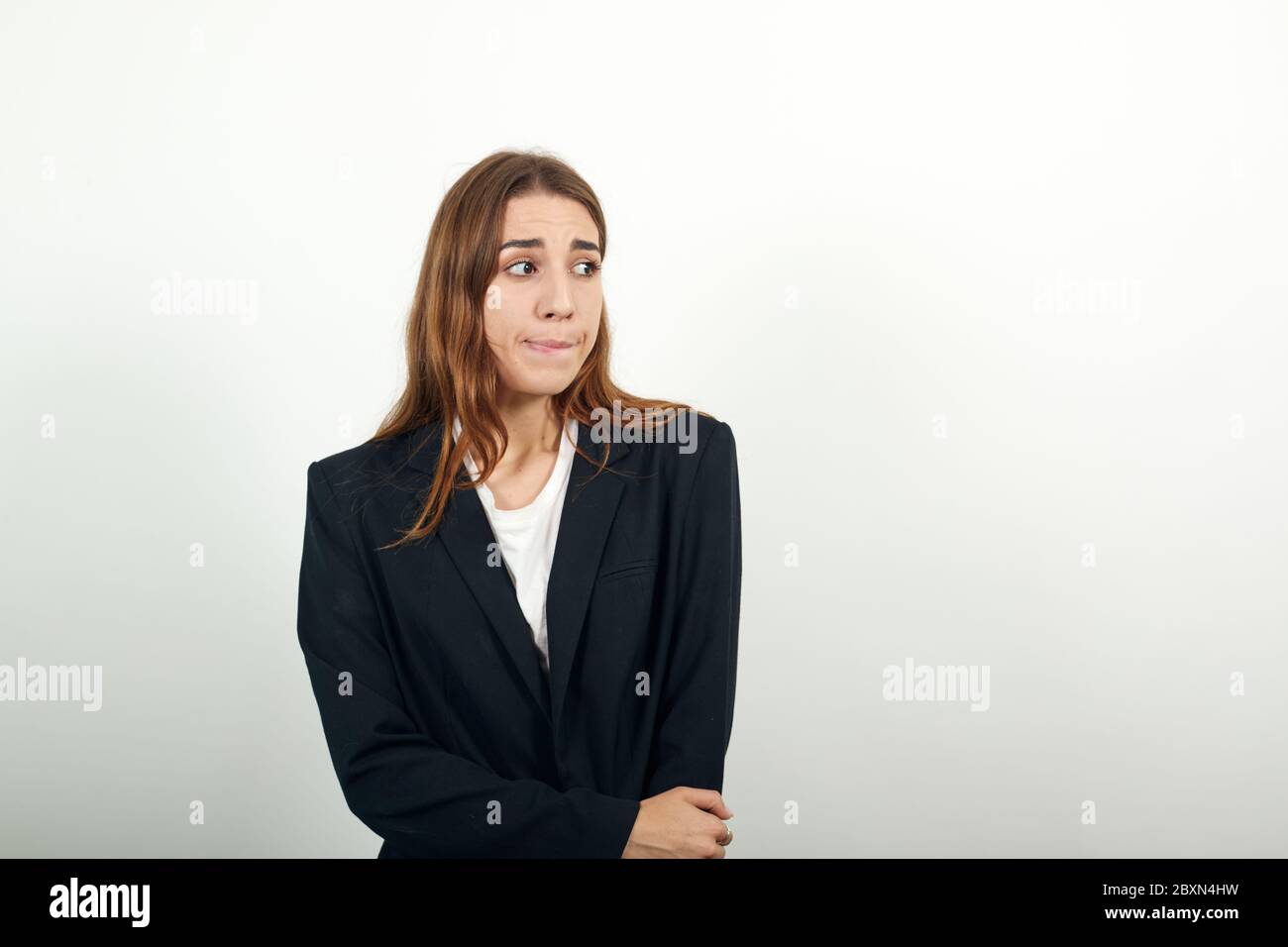 Woman bitting lip hi-res stock photography and images - Alamy