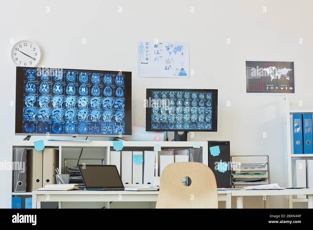 Background image of modern computer equipment with CT brain scans on ...