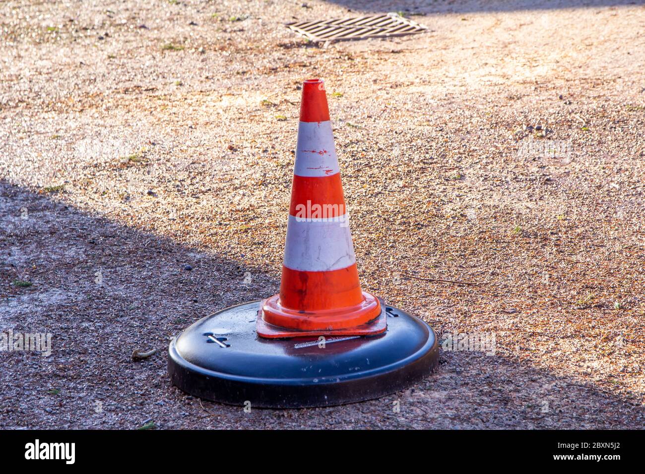 Plastic Traffic Cone sat on a Plastic Trash Can Lid Stock Photo - Alamy