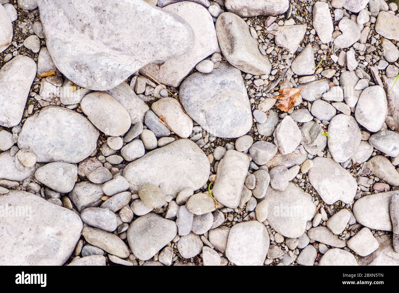 Naturally polished river washed rocks and pebbles Stock Photo - Alamy