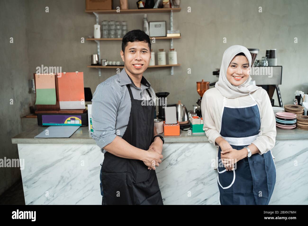 two waitress relax when take a rest with lean back on table in coffee ...