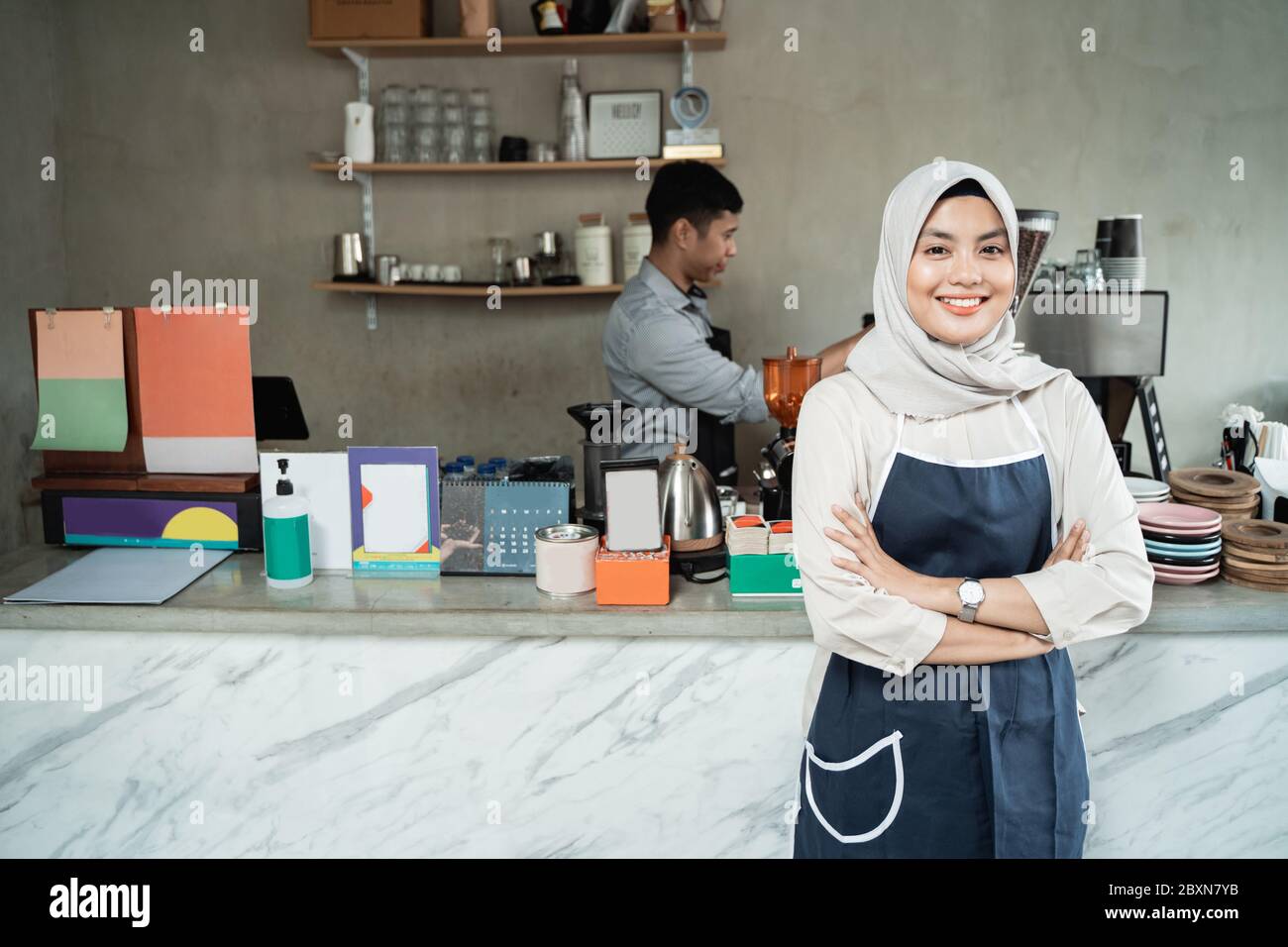 female waitress smile relax with crossed hands in coffee shop Stock ...