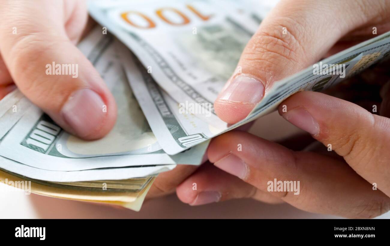 Closeup image of male businessman counting money in hands Stock Photo ...