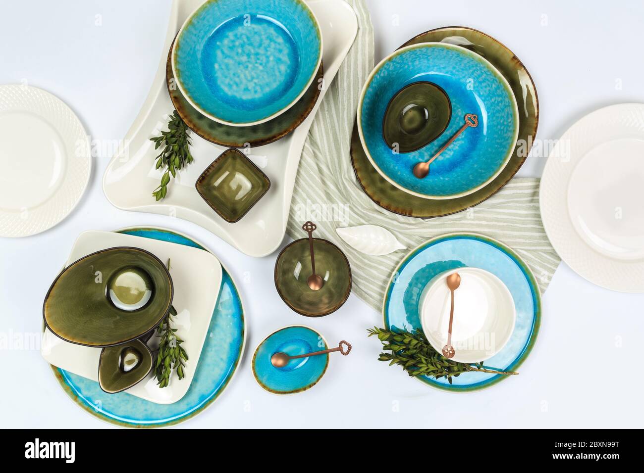 Simple rustic handmade blue crockery against white wooden wall: dish ...