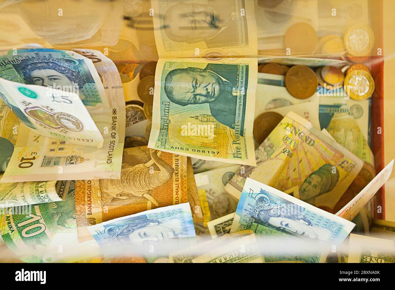 Money in a charity box from visitor donations, The Design Museum ...