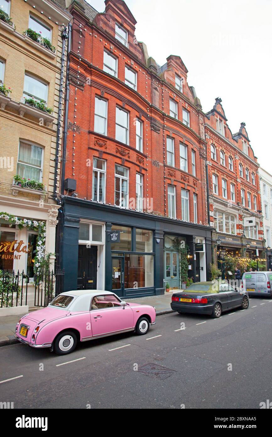 Pink Nissan Figaro car, Henrietta St, London Stock Photo - Alamy