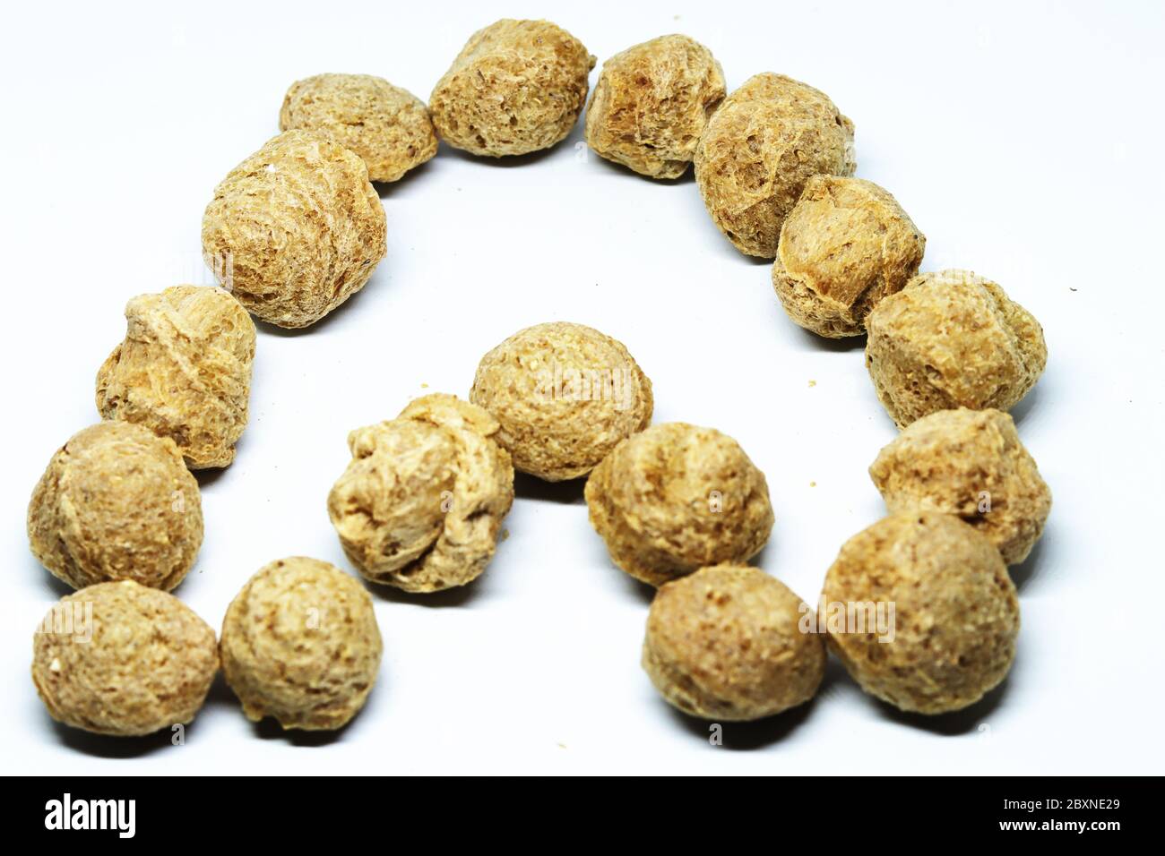 Soya protein chunks used in vegetarian and vegan food, isolated on a ...