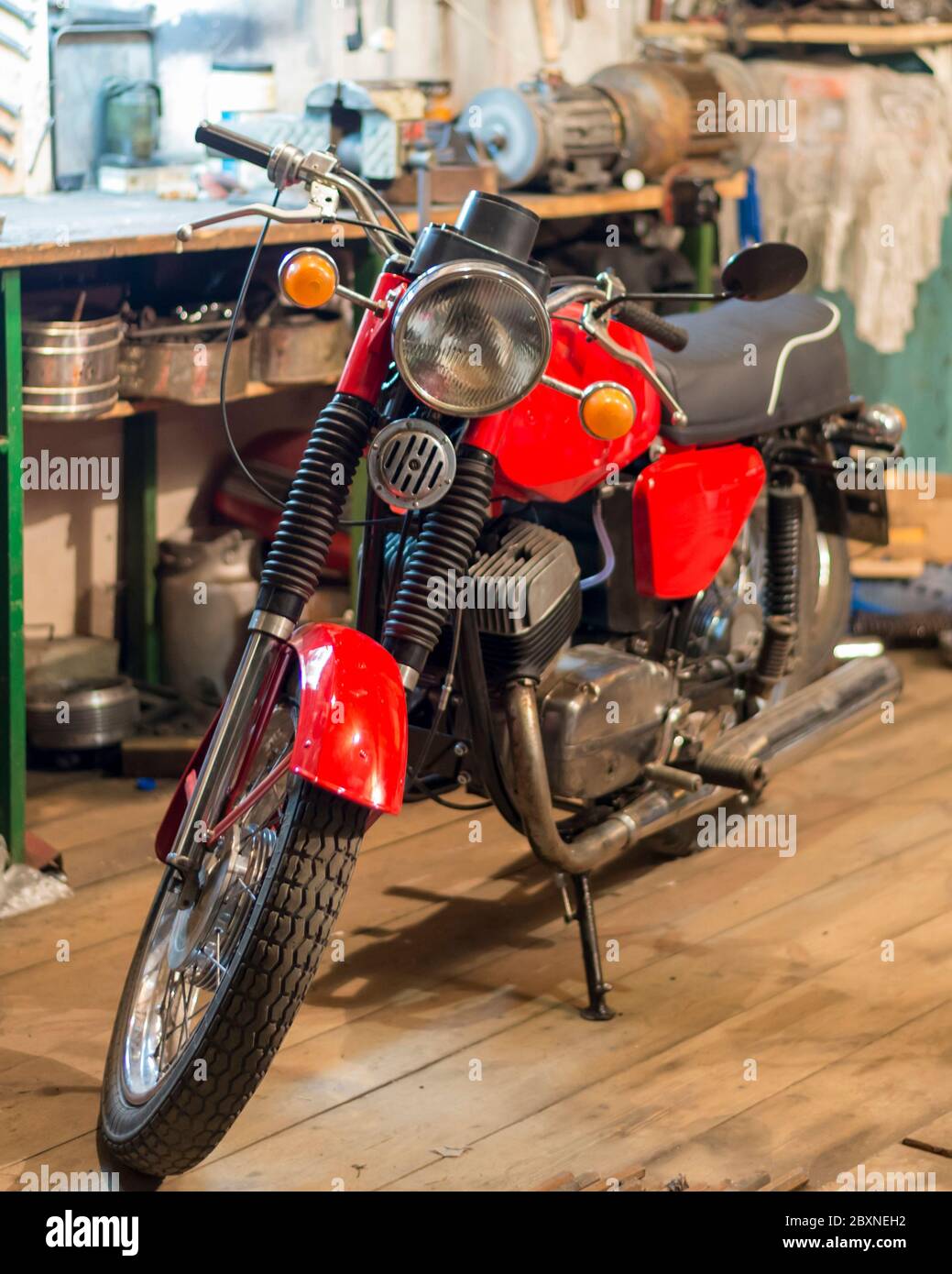 Red vintage retro motorcycle parked in the garage Stock Photo - Alamy