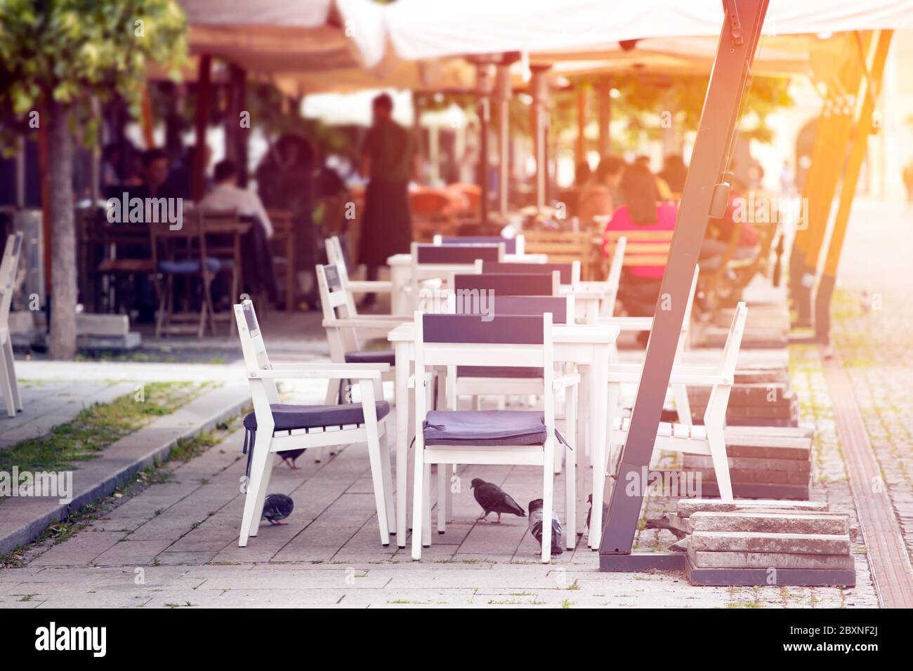 Street cafe and restaurant table and chair Stock Photo - Alamy