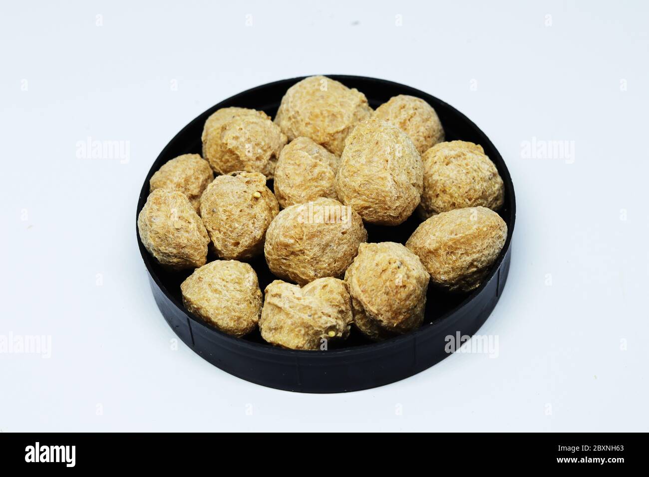 Soya protein chunks used in vegetarian and vegan food, isolated on a ...