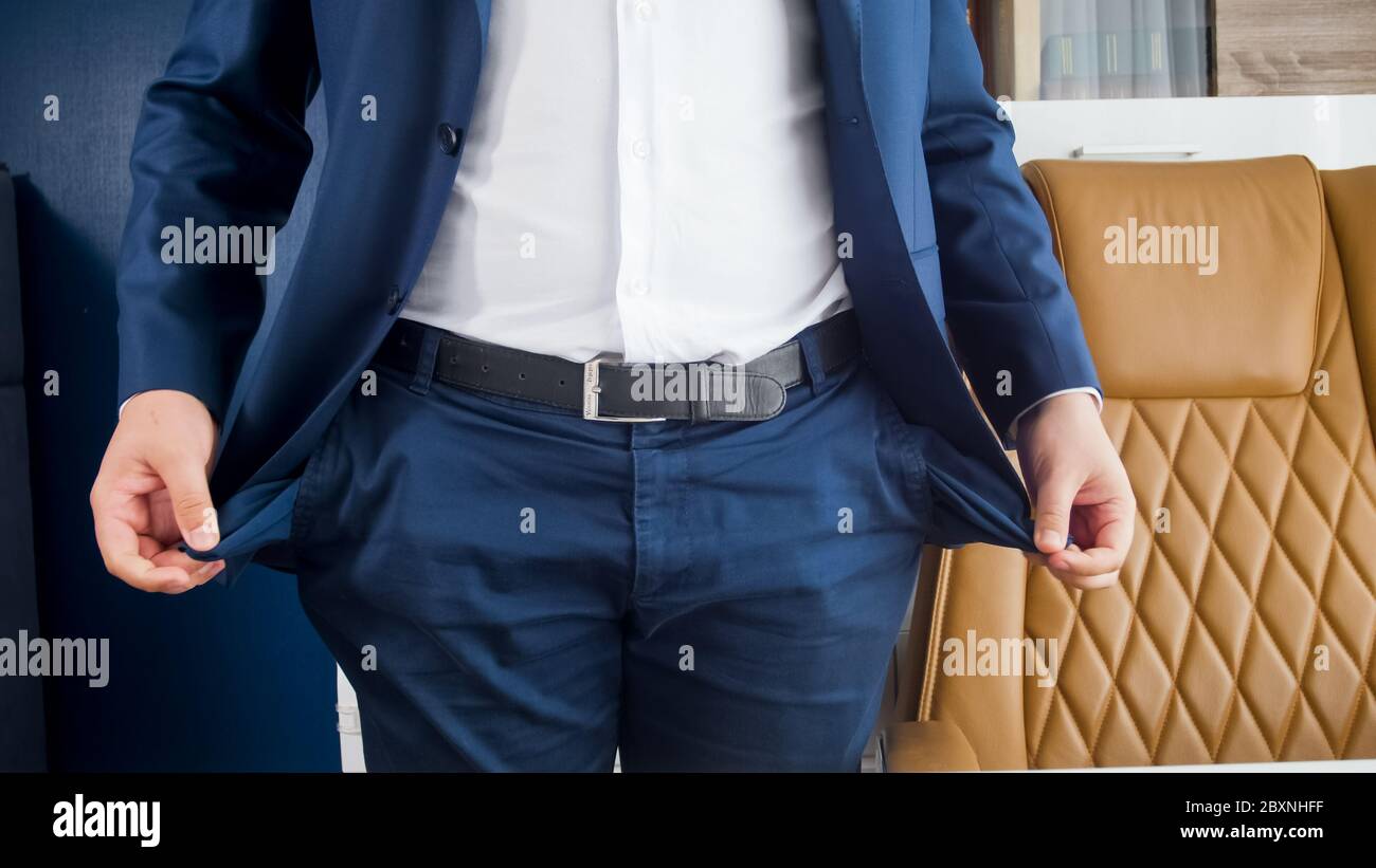 Businessman pulling out empty pockets hi-res stock photography and ...