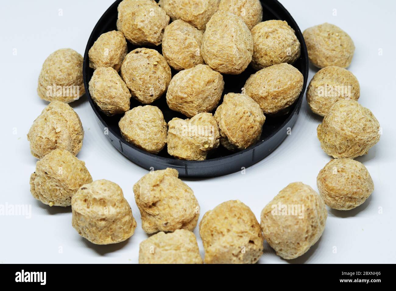 Soya protein chunks used in vegetarian and vegan food, isolated on a ...