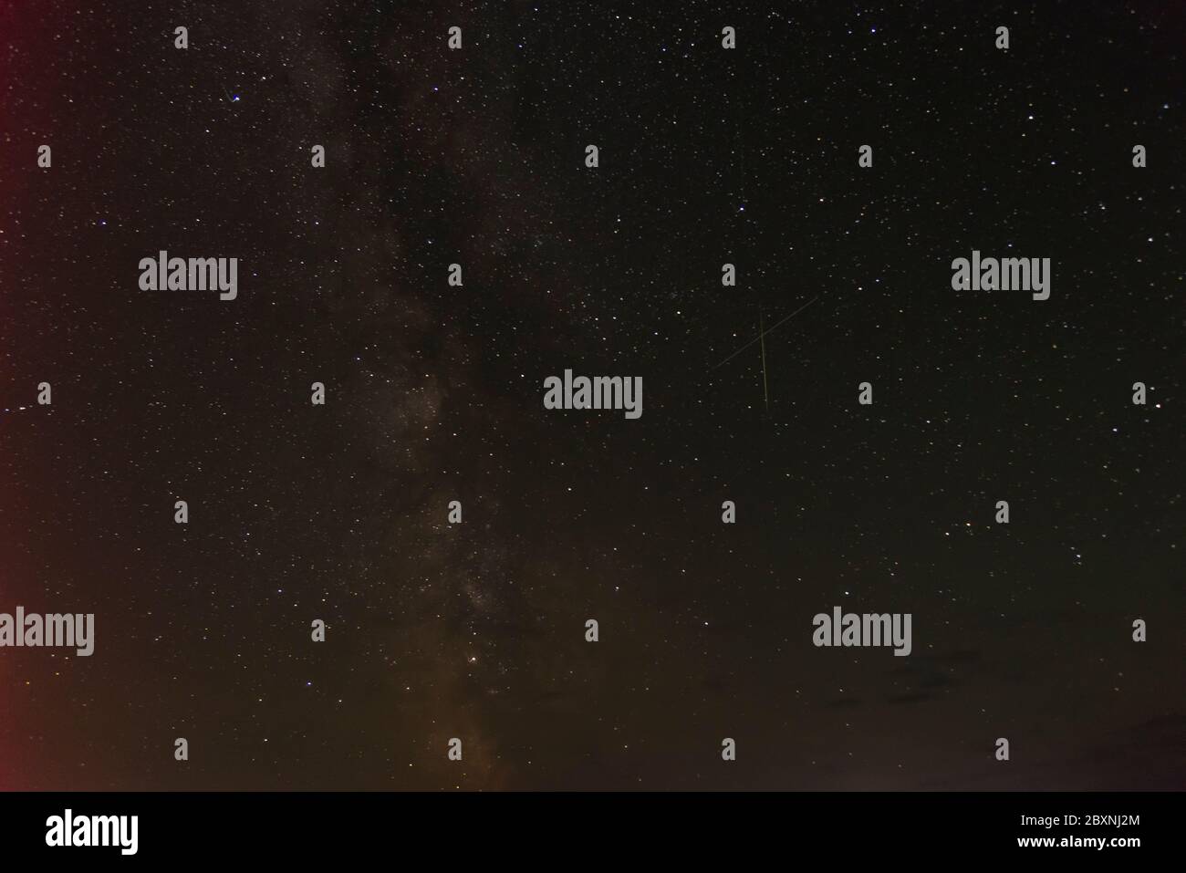 Photo two falling stars and of Milky Way in the beautiful starry sky ...