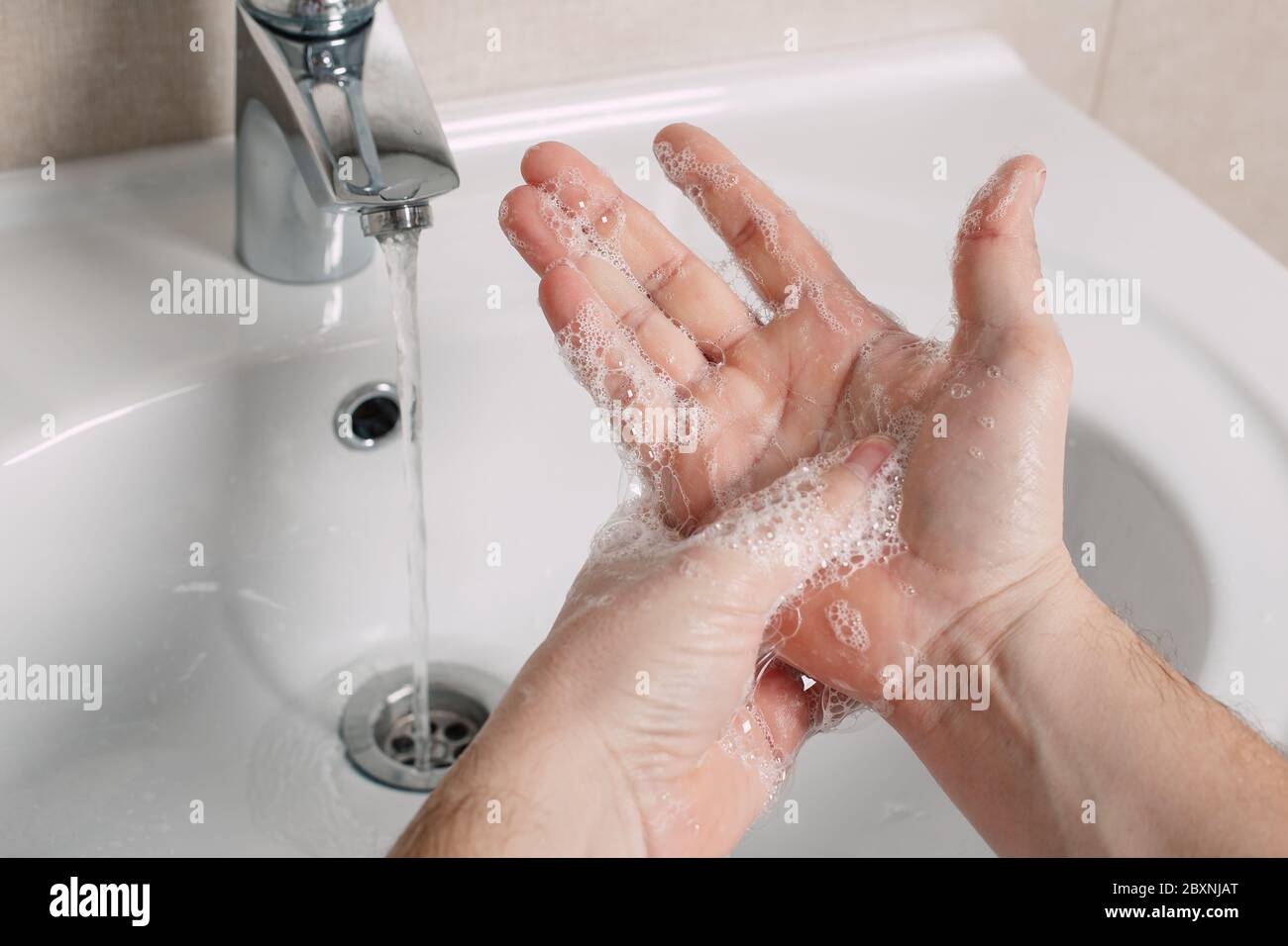 Washing hands under the water tap or faucet without soap. Hygiene ...