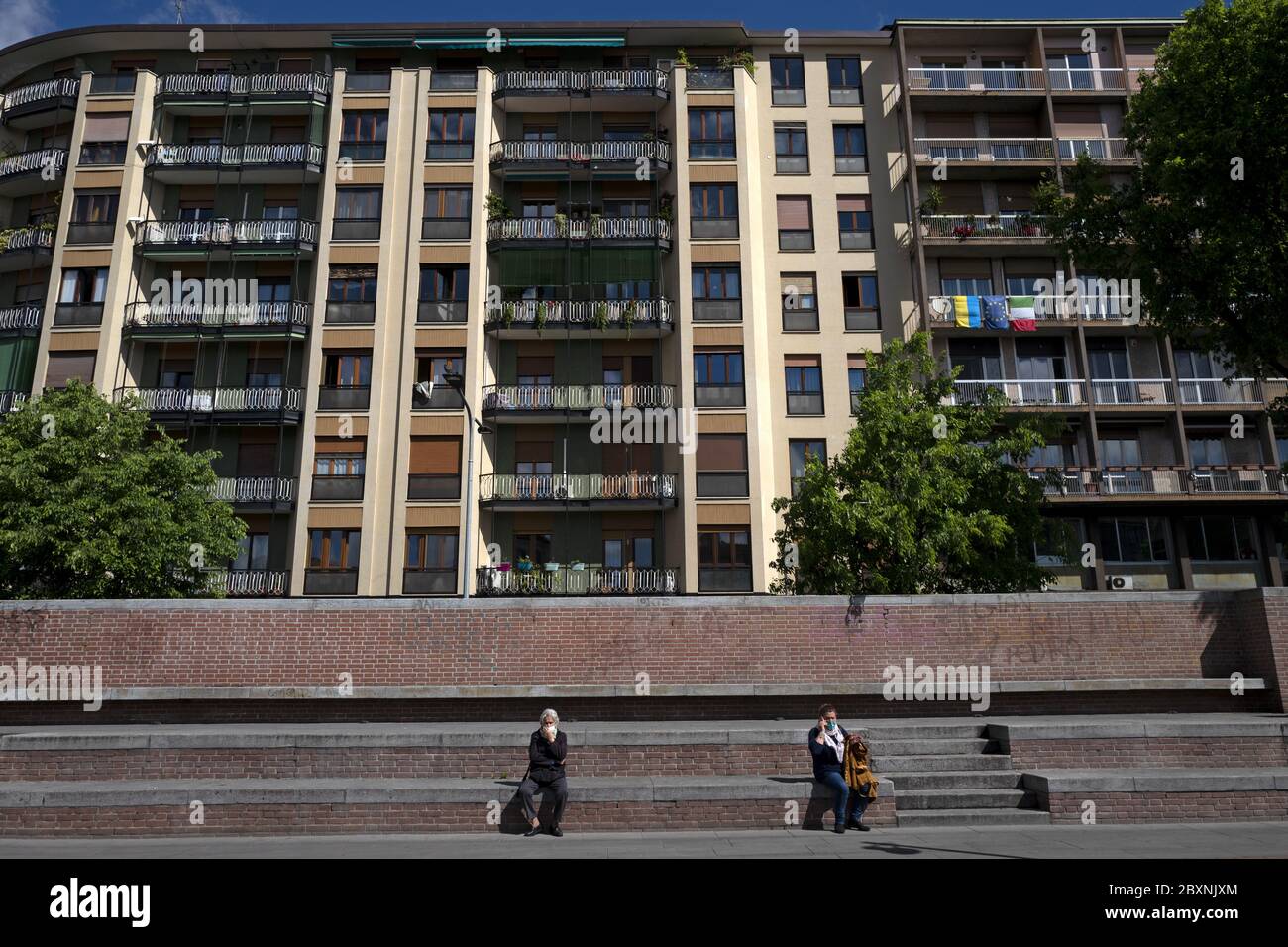 Two people seat mainteining the social security distance during the ...