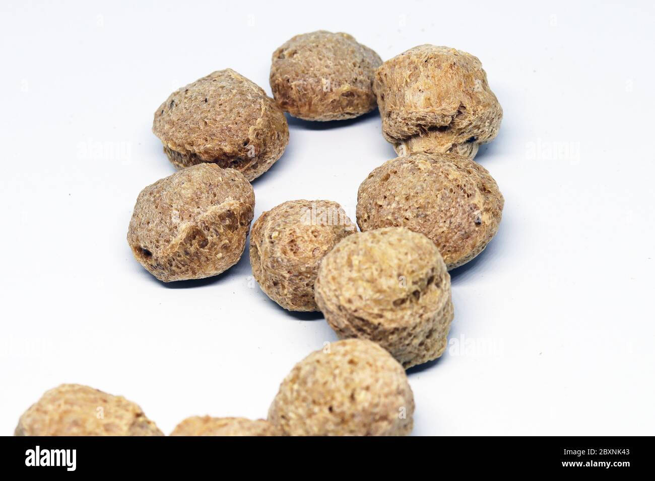 Soya protein chunks used in vegetarian and vegan food, isolated on a ...