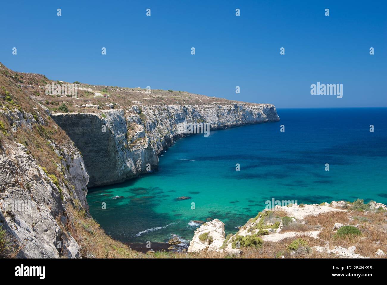 Maltese coastline with the cliffs,gold rocks over the sea in the Malta ...