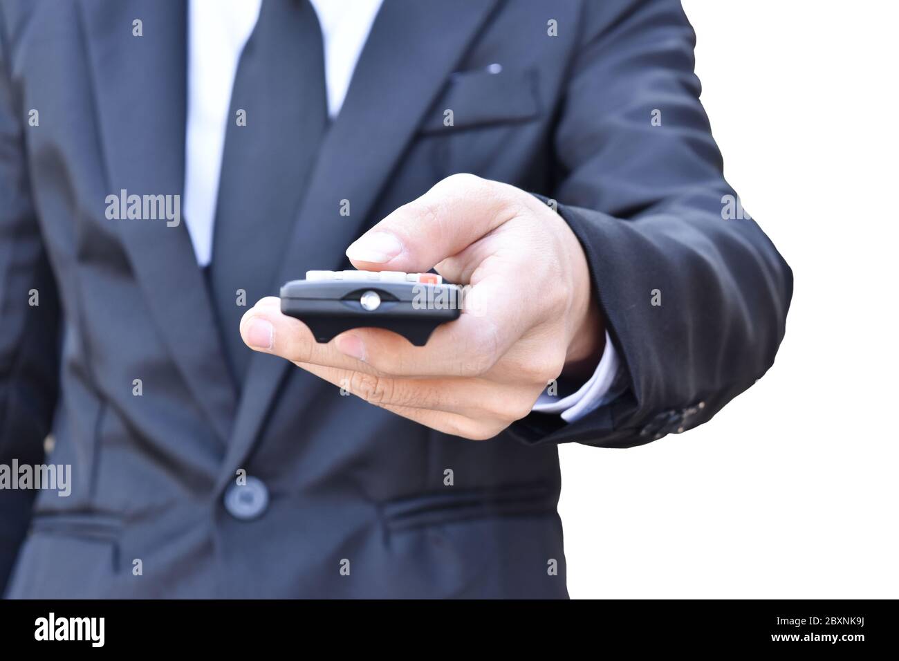 Businessman hand holding black remote control isolated on white ...