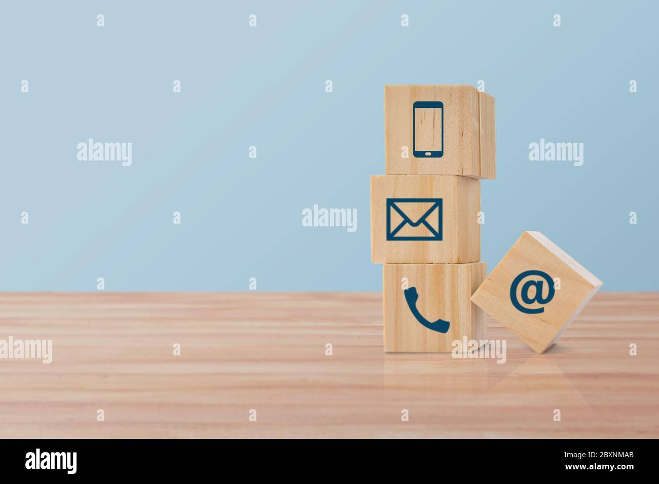 wooden block cube with (telephone, email, address) icon. Concept of ...