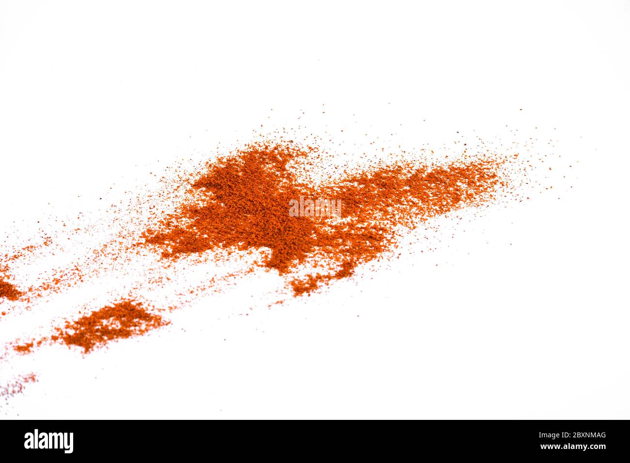 Red chili pepper powder isolated on white background Stock Photo - Alamy