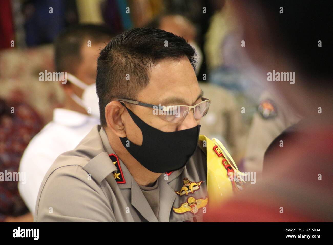 Police officers wear masks in the room Stock Photo - Alamy