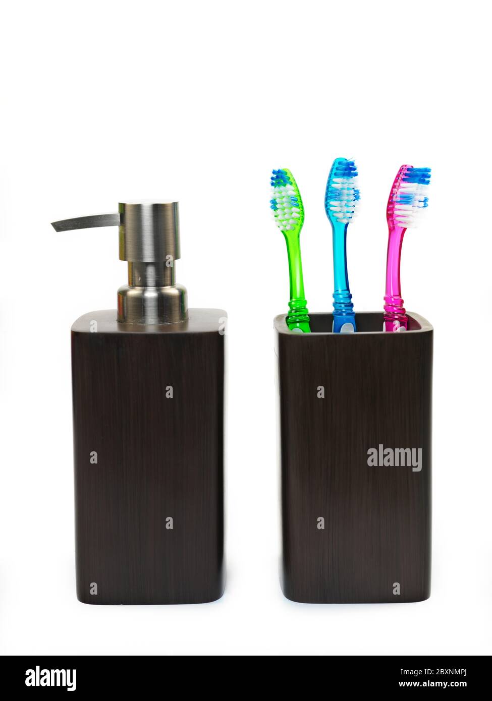 Tooth brushes in cup hi-res stock photography and images - Alamy