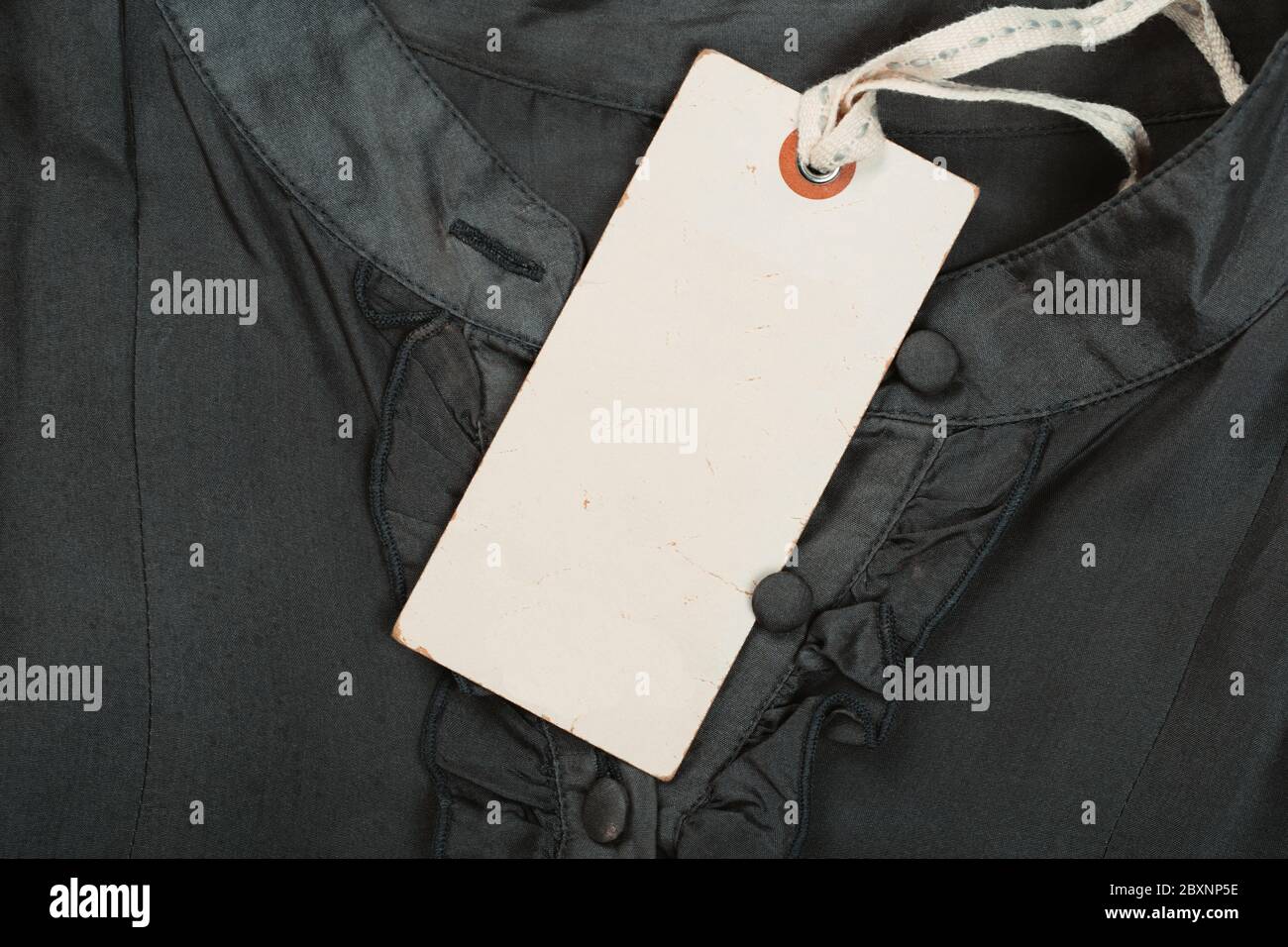 Rectangular Tag on a clothes. fashion, people and shopping concept ...