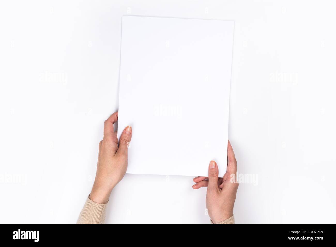 Woman's hands with perfect manicure holding notepad as mockup for your ...