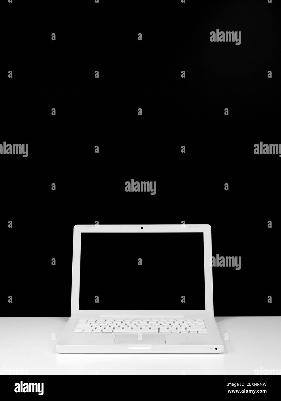 A contempory workplace office desk with a black background Stock Photo ...