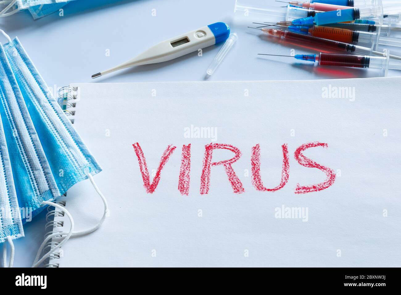 The inscription virus in red letters. The concept of viral diseases and ...
