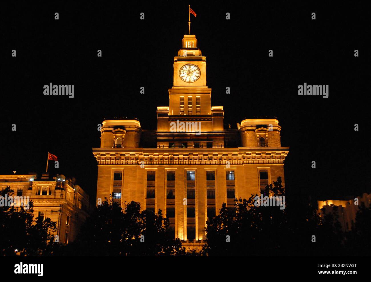 The Custom House on the Bund in Shanghai, China. The Bund is a ...